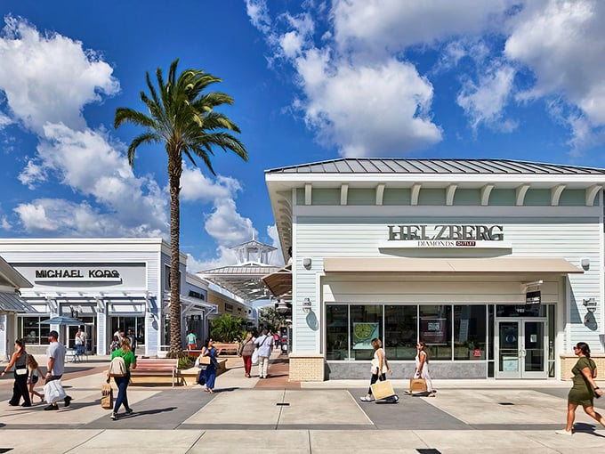 The white-washed storefronts and swaying palms create a shopping oasis that feels more vacation than errand.