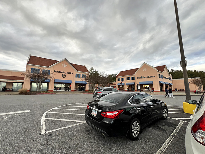 Where designer dreams meet budget realities &ndash; Michael Kors and Polo Ralph Lauren beckon under moody Georgia skies.
