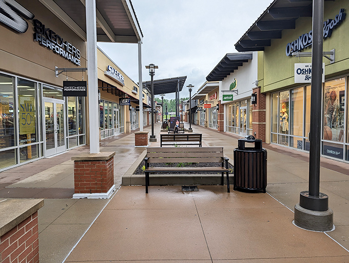 Wide, inviting walkways lined with comfortable benches create shopping paths that feel more like a pleasant stroll than a retail marathon.