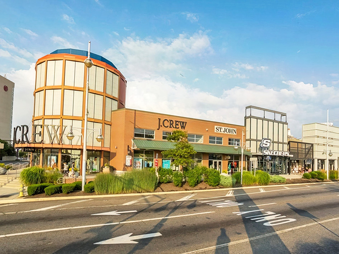 The architectural flair of J.Crew and St. John storefronts welcomes shoppers like a retail red carpet, promising treasures within those sandy-hued walls.