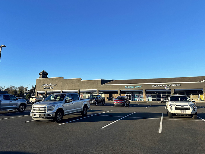 The modern exterior of the Seaside Outlet Mall beckons bargain hunters with that iconic swoosh overhead.