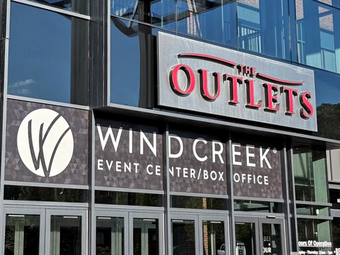 The sleek entrance to The Outlets at Wind Creek Bethlehem&mdash;where your wallet's worst nightmare becomes your wardrobe's dream come true.