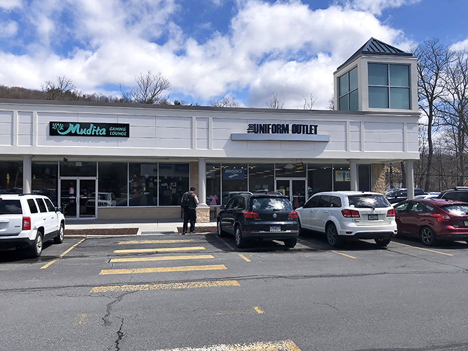 The clean white facades of Pocono Premium Outlets blend seamlessly with the mountain backdrop, like a retail oasis waiting to be discovered.