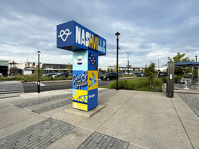 The iconic blue Nashville sign welcomes bargain hunters like a beacon of hope for wallets everywhere. Shopping paradise awaits beyond.