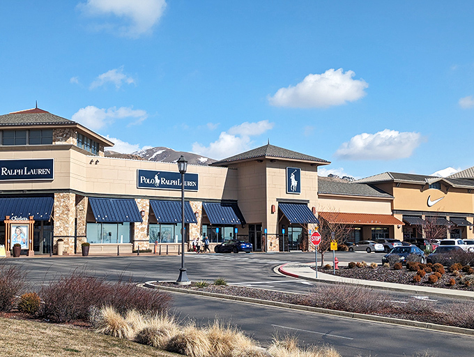 Stone and stucco architecture meets mountain views—because even outlet malls deserve a scenic backdrop in Utah.