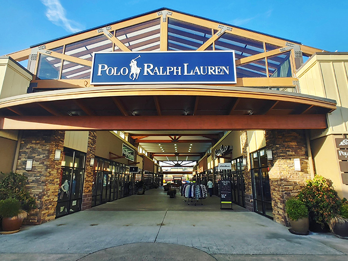 The iconic blue and white Polo Ralph Lauren sign welcomes bargain hunters to their fashion paradise. Northwest-inspired architecture adds a touch of local charm to this designer destination.