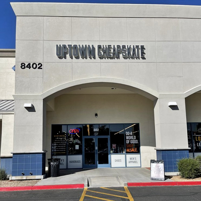 The desert sun bounces off Uptown Cheapskate's clean facade, promising air-conditioned treasure hunting within. Fashion salvation awaits behind those doors!