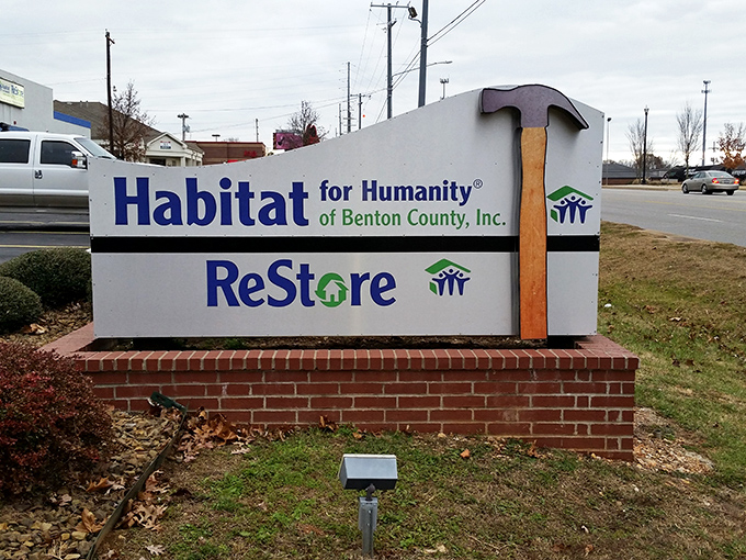 The iconic Habitat for Humanity ReStore sign welcomes bargain hunters to Bentonville's treasure trove of secondhand possibilities and DIY dreams.