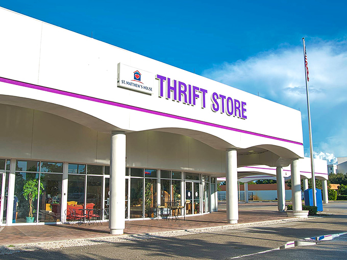 The purple-trimmed facade of St. Matthew's House gleams under Florida's blue sky, promising treasure hunters a paradise of possibilities within.