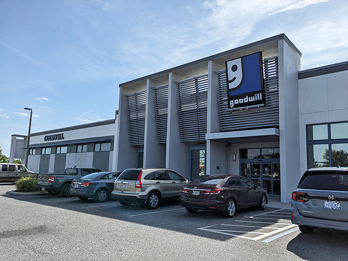 The modern facade of Goodwill Goldenrod stands like a retail oasis in Orlando, promising treasures within those sliding glass doors.