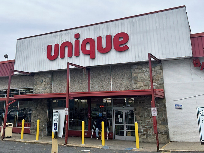 The iconic red "unique" sign beckons bargain hunters like a retail lighthouse guiding ships to treasure-filled shores.