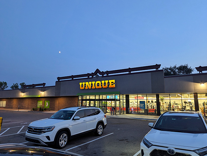 Unique's exterior glows like a beacon of thrifty hope against the twilight sky, promising treasures within that won't break the bank.