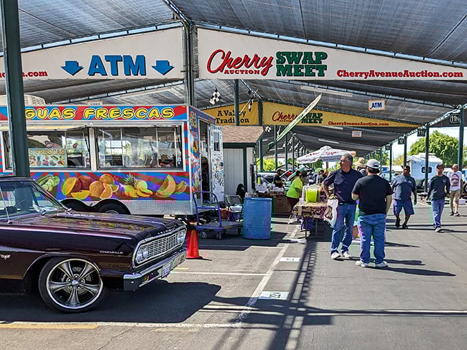Welcome to bargain paradise! The colorful entrance to Cherry Avenue Auction promises treasures waiting to be discovered under those shady canopies.