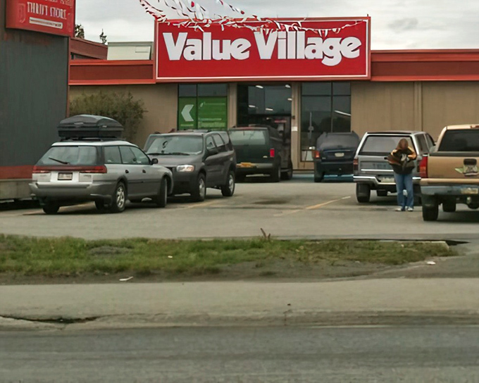 Alaskan practicality on display: Subarus and pickup trucks fill the lot, their owners inside hunting for deals while saving some serious cash.