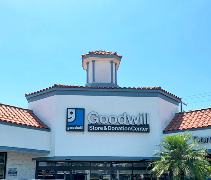 The Spanish-style architecture with its distinctive cupola and terracotta roof tiles makes this Goodwill look more like a boutique resort than a thrift store paradise.