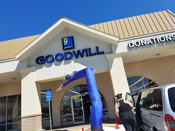 Sunny skies frame this thrifter's paradise, where one person's donations become another's fashion statement &ndash; all under that iconic blue "g" logo.