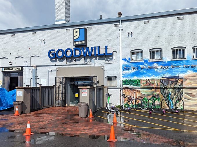 The iconic white brick facade with bold blue lettering stands as Denver's beacon of bargain hunting, complete with Colorado landscape murals that hint at treasures within.