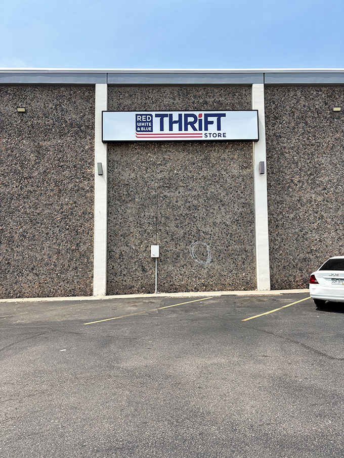 The unassuming exterior of Red White & Blue Thrift Store &ndash; proof that treasure hunting doesn't always begin with a fancy facade.
