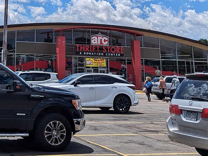 The distinctive red pillars and modern glass frontage of arc Thrift Store stand out like a beacon for bargain hunters cruising Littleton Boulevard.