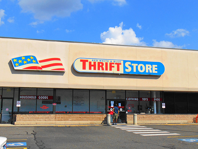The patriotic facade promises treasure hunting adventures within. Like a retail archaeological dig where the artifacts cost less than your morning coffee.