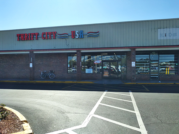 The unassuming storefront of Thrift City USA beckons with its patriotic signage—proof that treasure hunting doesn't require fancy facades, just fantastic finds inside.