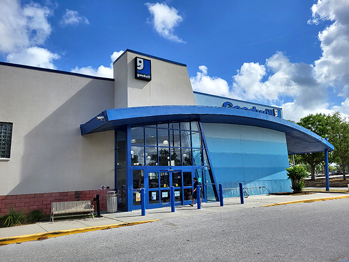 The distinctive blue-accented facade of Goodwill Brandon Superstore stands like a beacon for bargain hunters under Florida's impossibly perfect sky.