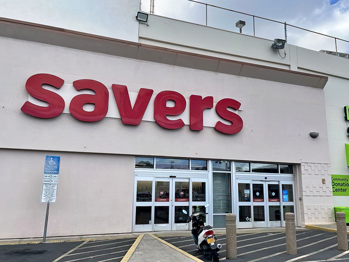 The bright red Savers sign stands like a beacon of bargain hope against Hawaii's blue sky, promising treasure hunts without the sunburn.