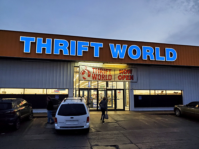 The iconic blue signage of Thrift World glows like a beacon for bargain hunters, promising treasures waiting to be discovered inside.