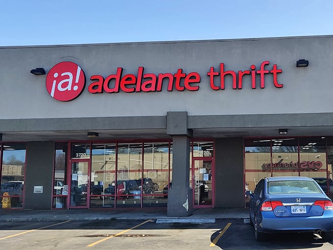 The bright red signage of Adelante Thrift beckons like a lighthouse for bargain hunters. This unassuming storefront houses treasures waiting to be discovered. 