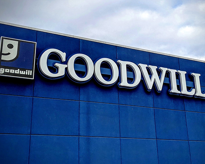 The iconic blue Goodwill facade stands like a beacon of bargain possibilities, promising treasures within for the patient hunter.