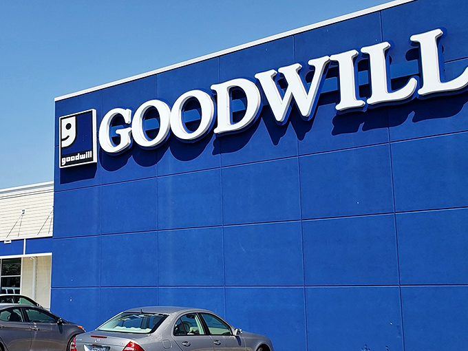 The iconic blue facade of Goodwill Ellicott City stands like a retail Narnia – ordinary on the outside, magical treasures within.