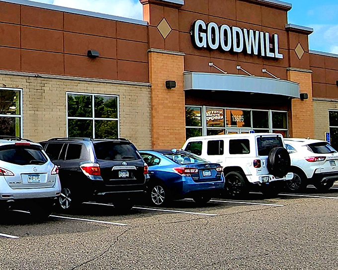 The brick facade of Goodwill Maple Grove welcomes bargain hunters like a retail promised land, complete with ample parking for treasure-seekers from across Minnesota.