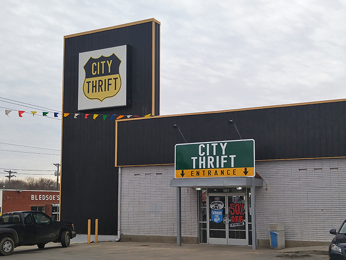 The iconic City Thrift sign beckons bargain hunters like a retail lighthouse. Those colorful pennants aren't just decoration&mdash;they're celebration flags for your wallet.