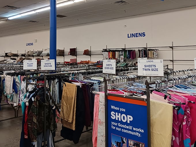 The modern facade of Goodwill on Rainbow Boulevard stands like a retail oasis in the desert, promising treasures within its air-conditioned walls.