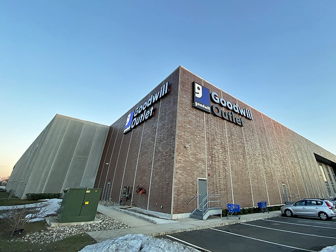 The unassuming brick fortress of bargains stands ready for treasure hunters. No fancy frills, just pure thrifting potential waiting inside.