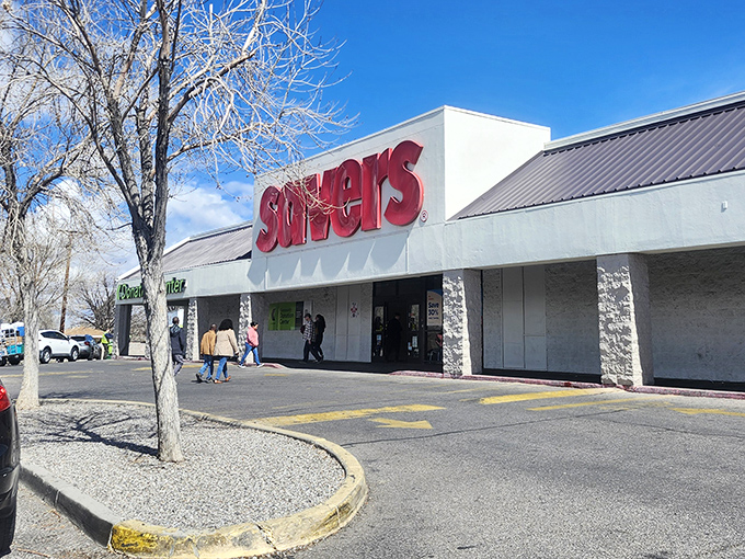 The iconic red Savers sign stands out against the New Mexico sky, promising treasure hunters a day of affordable discoveries.