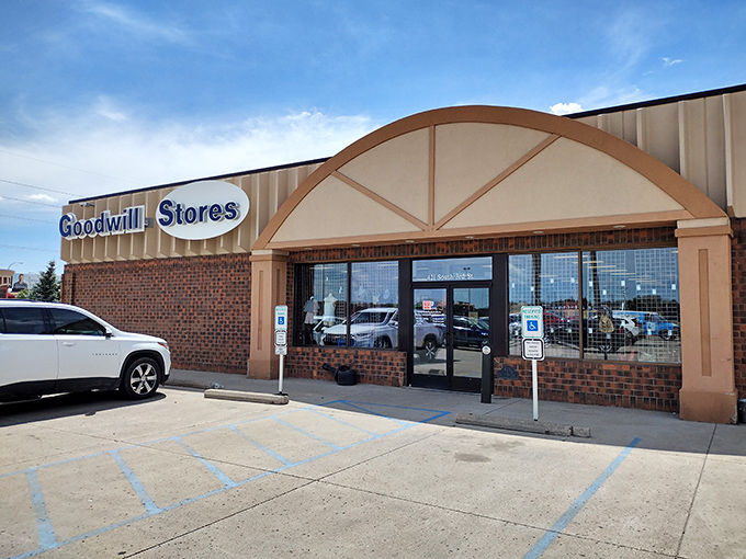 The unassuming brick facade of Bismarck's Goodwill hides a universe of possibilities within. Like a treasure chest disguised as a building.