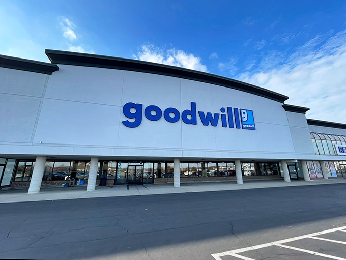 The blue Goodwill sign beckons like a lighthouse for bargain hunters. This Columbus treasure trove promises adventures in thrifting under bright Ohio skies.
