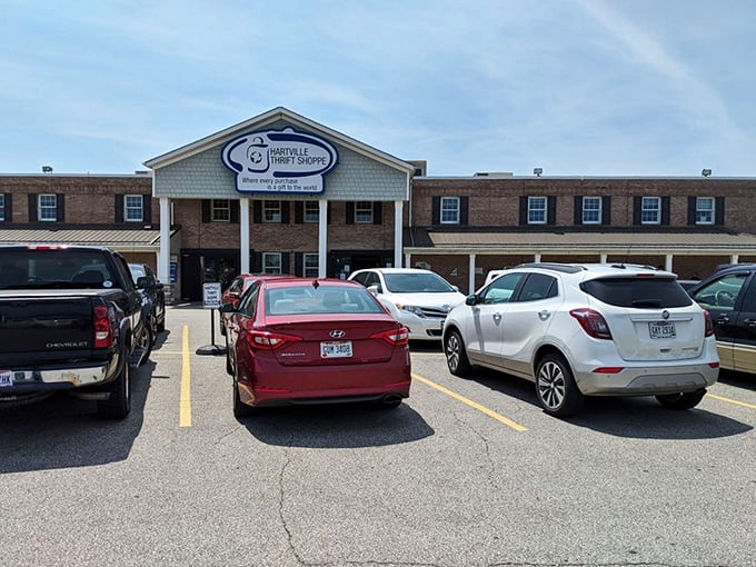 The stately facade of Hartville Thrift Shoppe promises treasure hunting adventures behind those columns, where every purchase truly is a gift to the world.