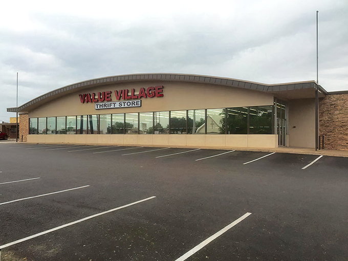 The curved facade of Value Village beckons like a siren song to bargain hunters. Those red letters might as well say "Treasure Awaits."
