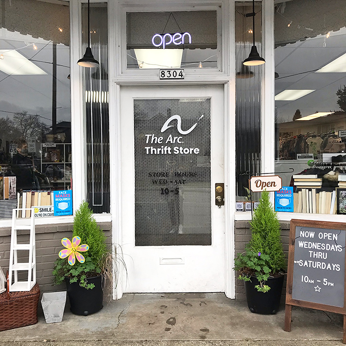 "Welcome to treasure-hunting paradise! The Arc Thrift Store's inviting entrance promises adventures in secondhand splendor while supporting a meaningful mission."