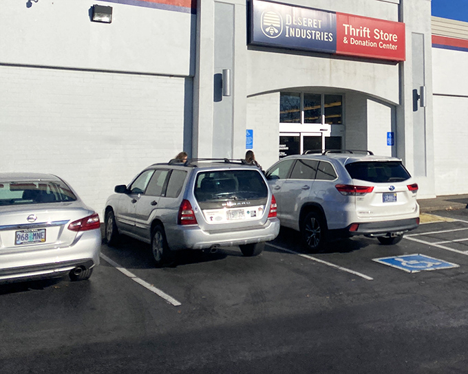 The unassuming exterior of Deseret Industries in Happy Valley hides a treasure trove within. Like all great adventures, this one begins with a simple doorway.