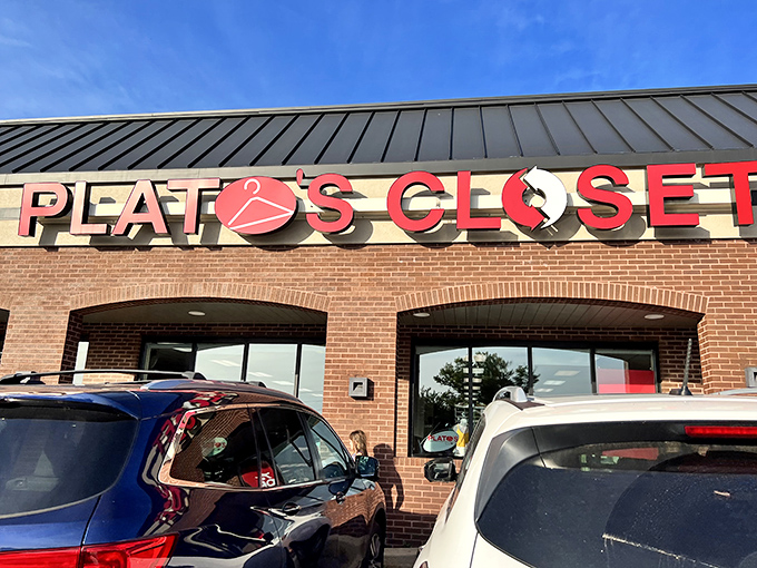 Another angle of fashion heaven! The iconic red hanger logo promises treasure hunting success for savvy shoppers under Lancaster's blue skies.