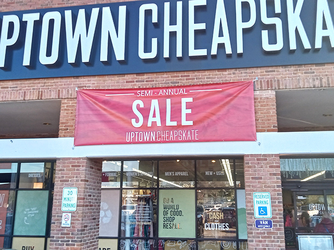 The red "SALE" banner against Uptown Cheapskate's brick facade is like a siren song to bargain hunters. Resistance is futile.