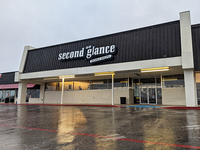 The unassuming black exterior of Second Glance hides a treasure trove within, like a pirate's chest disguised as a shopping mall tenant.