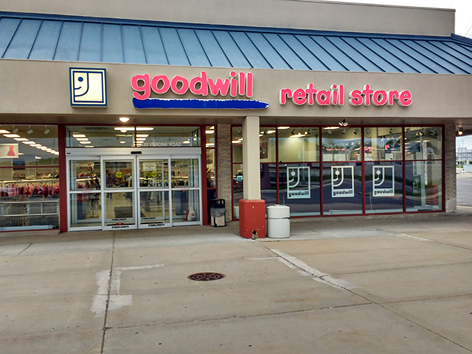 The iconic blue and red Goodwill sign beckons like a lighthouse for bargain hunters navigating the sea of retail inflation.