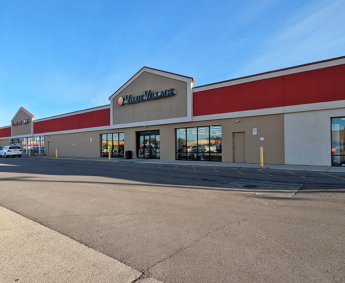A wider view of Value Village's exterior showcases its prominent signage against the bright blue Racine sky.