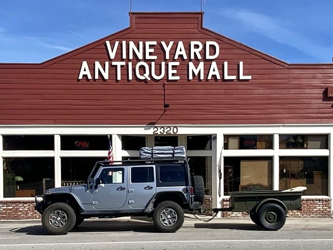 The iconic red facade of Vineyard Antique Mall stands like a beacon for treasure hunters, promising adventures that no Amazon algorithm could ever replicate.