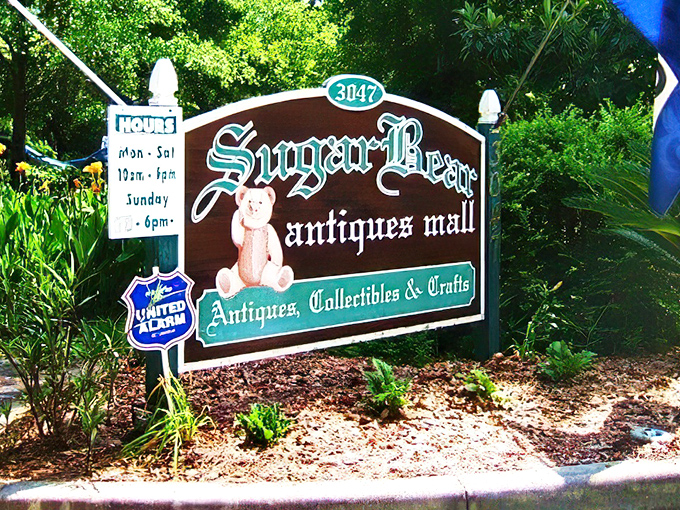 The welcoming sign to treasure-hunting paradise, where Spanish moss frames this vintage wonderland like nature's own spotlight.