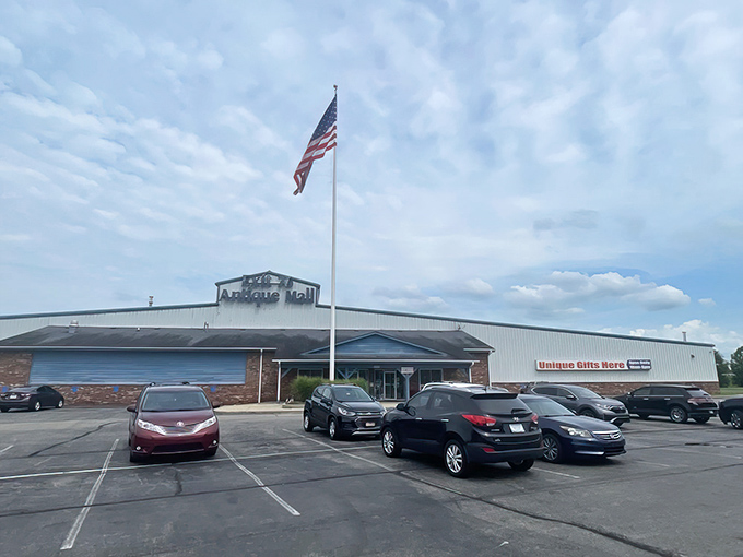 The unassuming exterior of Exit 76 Antique Mall stands like a time portal off I-65, its American flag waving in welcome to treasure hunters and nostalgia seekers alike.